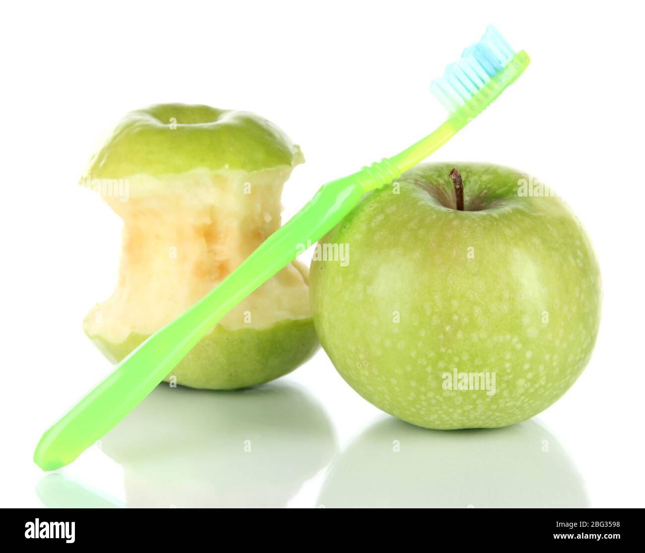 Apples with a toothbrush isolated on white Stock Photo - Alamy