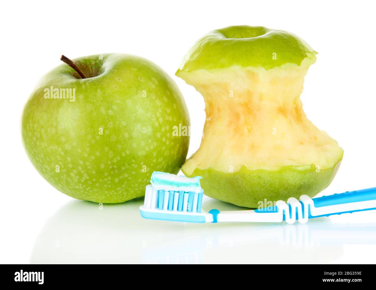 Apples with a toothbrush isolated on white Stock Photo - Alamy