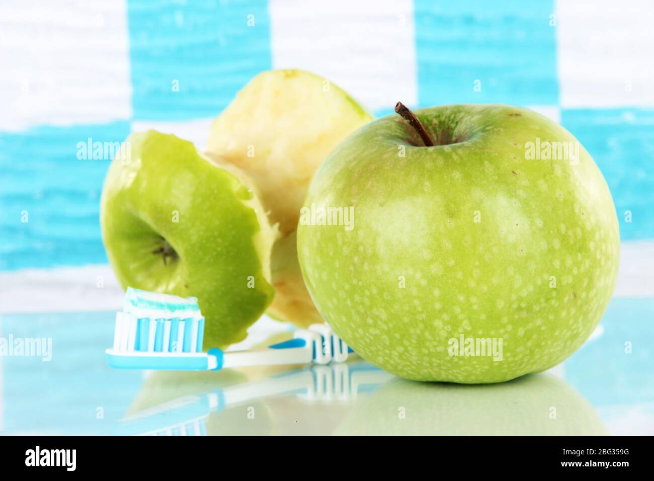 Apples with a toothbrush on shelf in bathroom Stock Photo - Alamy