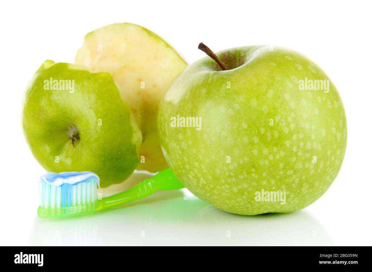 Apples with a toothbrush isolated on white Stock Photo - Alamy