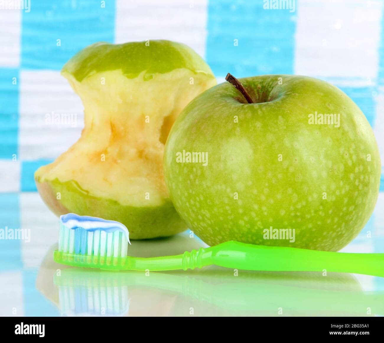 Apples with a toothbrush on shelf in bathroom Stock Photo - Alamy