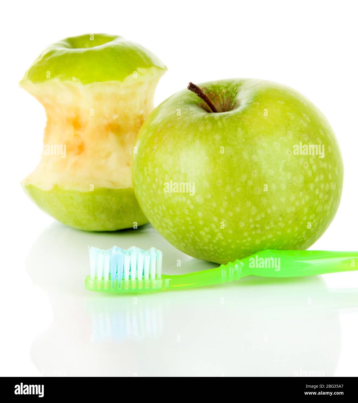 Apples with a toothbrush isolated on white Stock Photo - Alamy
