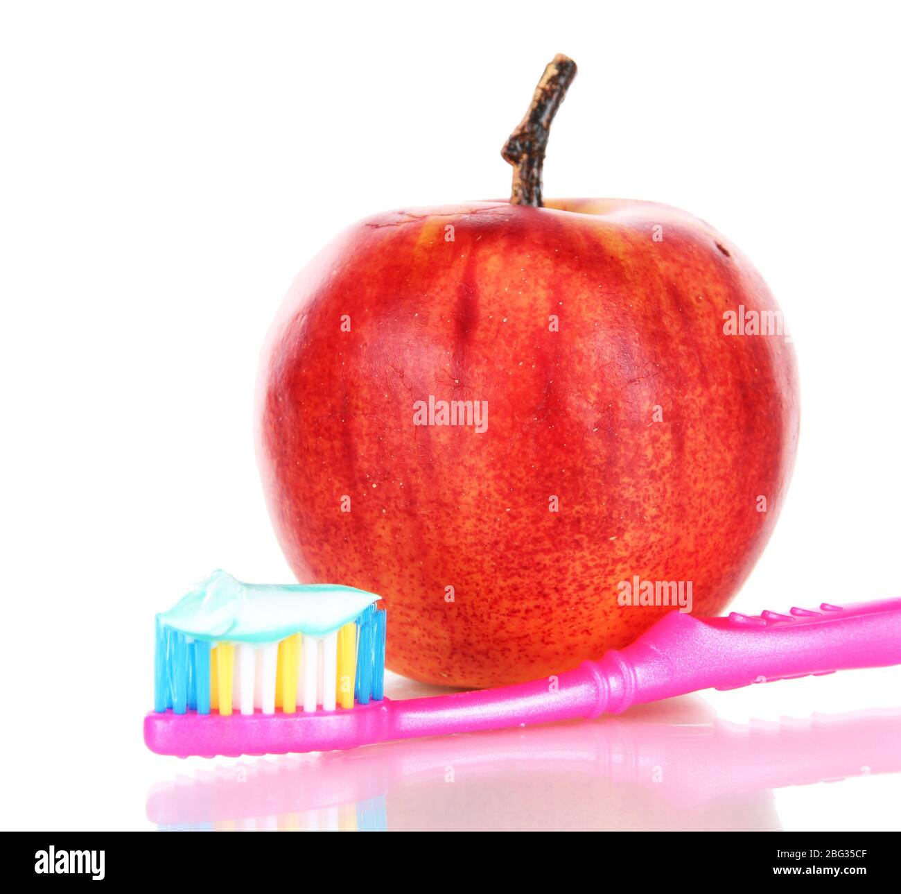 Apple with a toothbrush isolated on white Stock Photo - Alamy