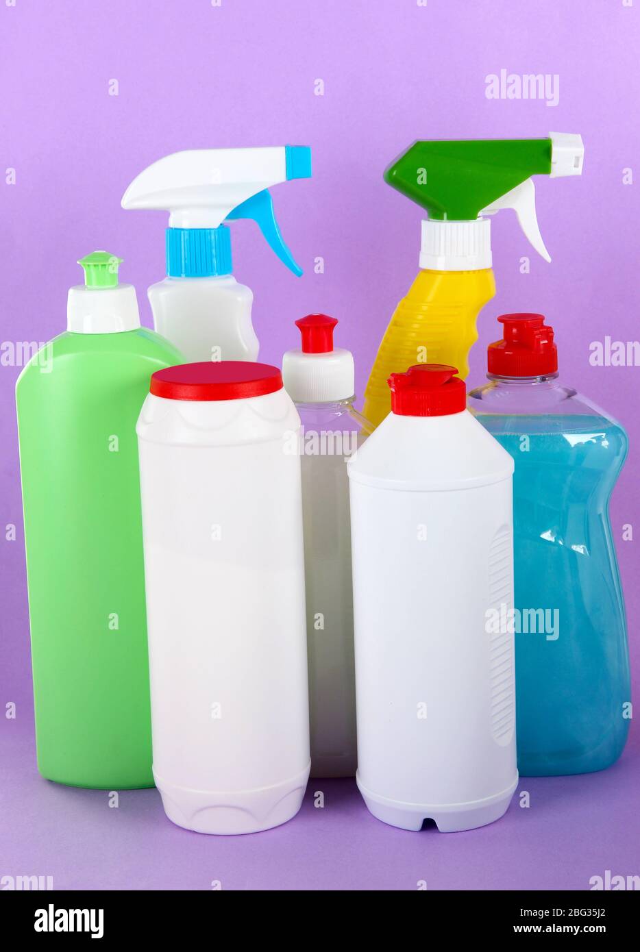 Different kinds of kitchen cleaners on color background Stock Photo - Alamy
