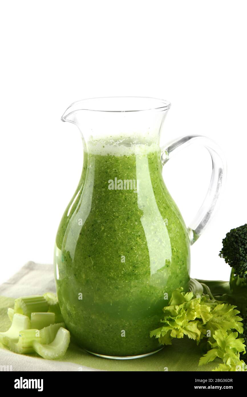 Glass pitcher of green vegetable juice isolated on white Stock Photo ...