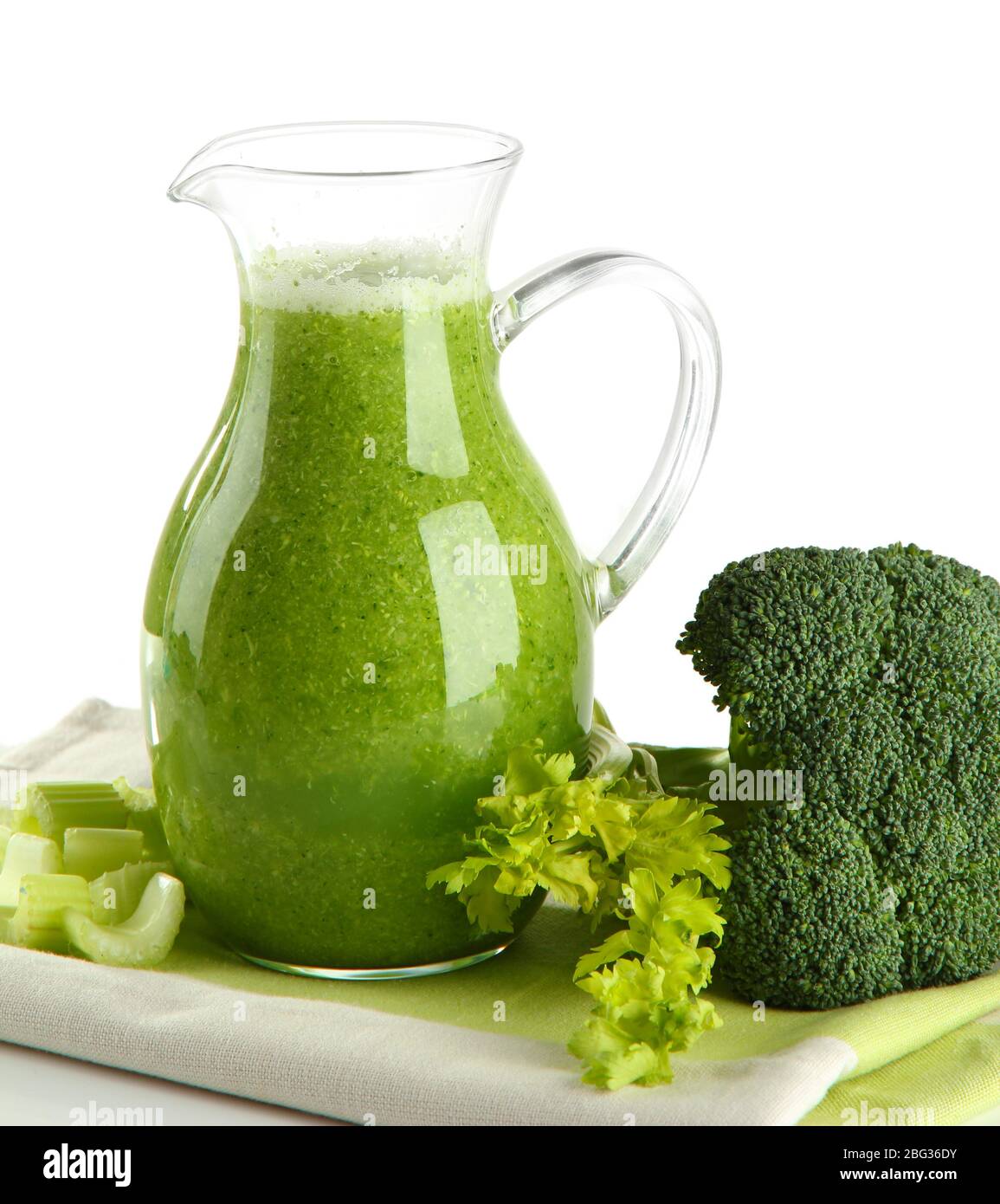 Glass pitcher of green vegetable juice isolated on white Stock Photo ...