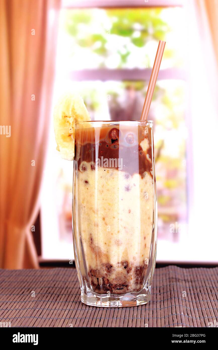 Delicious fruit smoothie on window background Stock Photo - Alamy