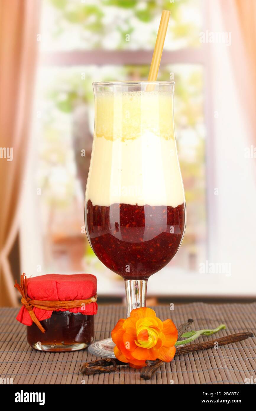 Delicious fruit smoothie on window background Stock Photo - Alamy