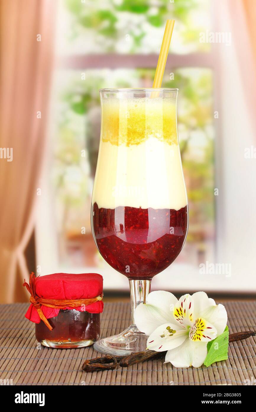 Delicious fruit smoothie on window background Stock Photo - Alamy