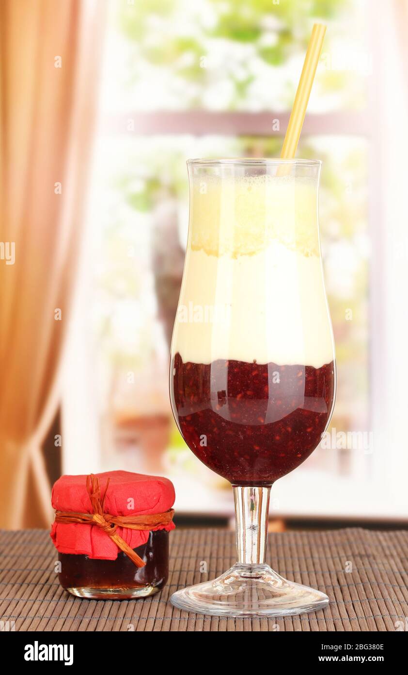 Delicious fruit smoothie on window background Stock Photo - Alamy