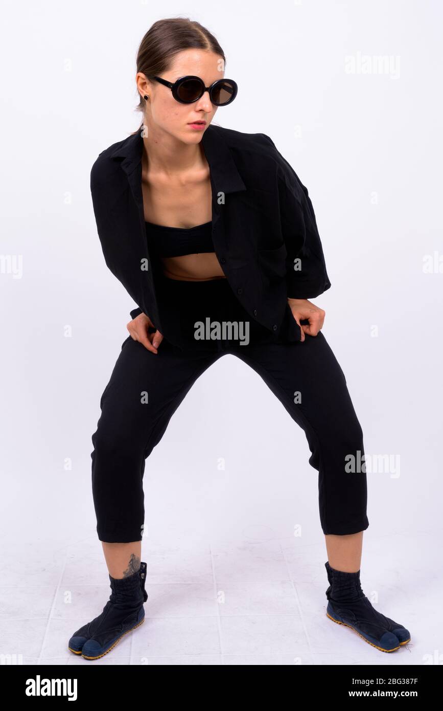 Full body shot of young beautiful woman as secret agent Stock Photo - Alamy