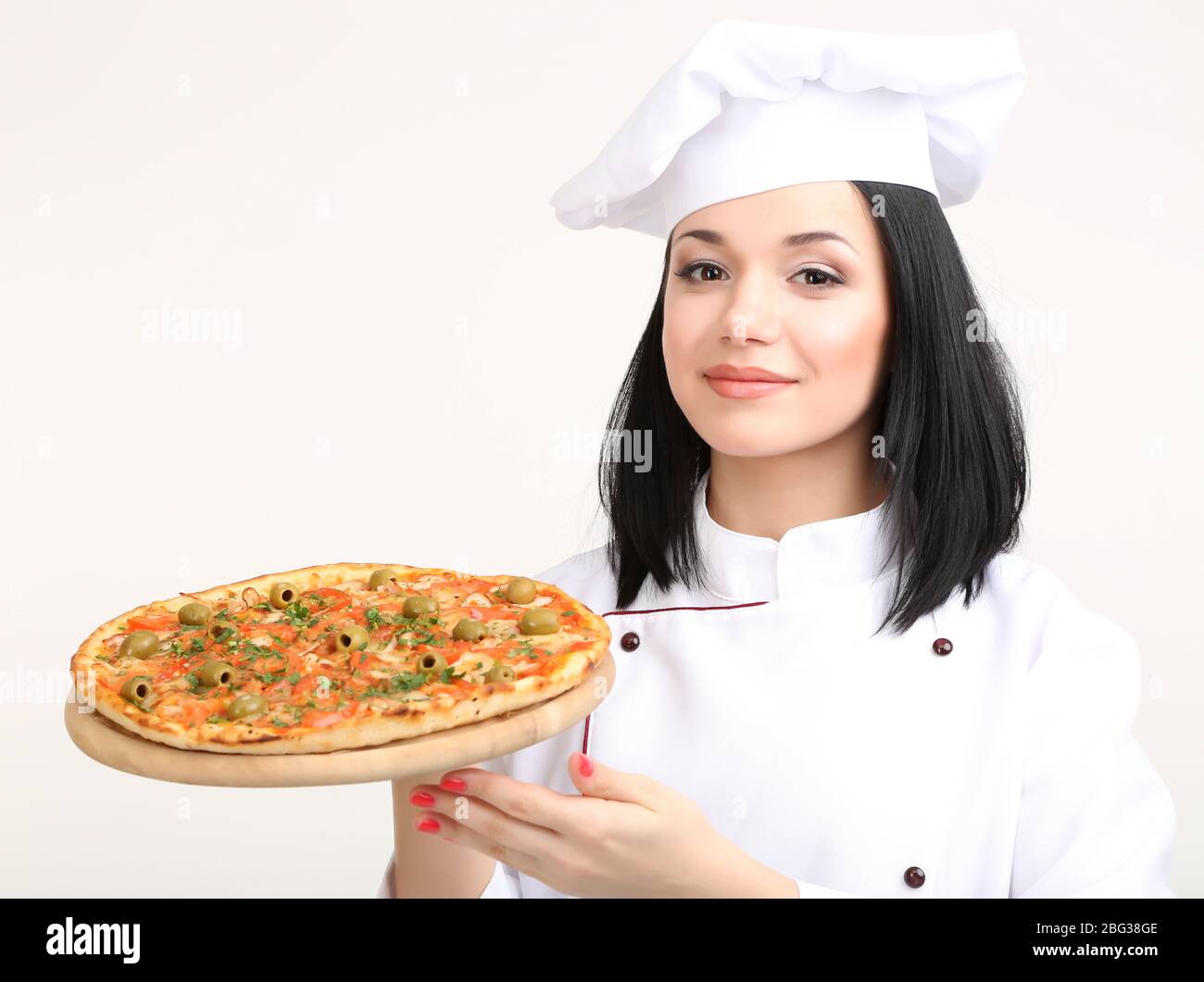 Beautiful girl chief-cooker with pizza isolated on white Stock Photo ...