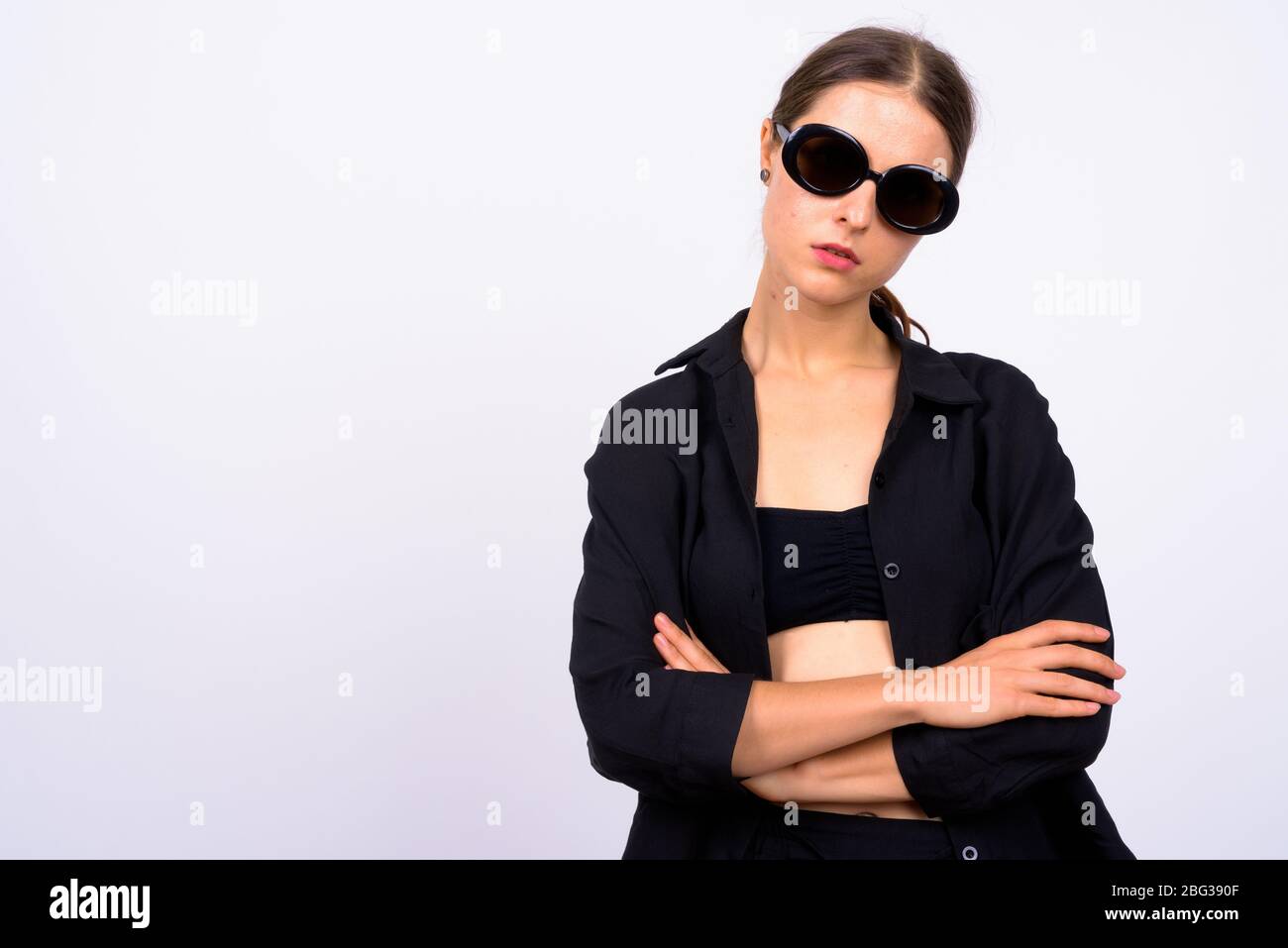 Young beautiful woman as secret agent against white background Stock ...
