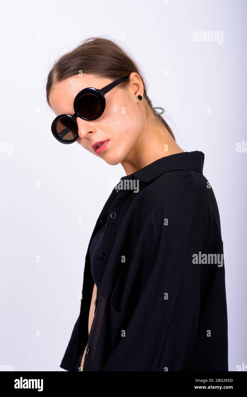 Young beautiful woman as secret agent against white background Stock ...
