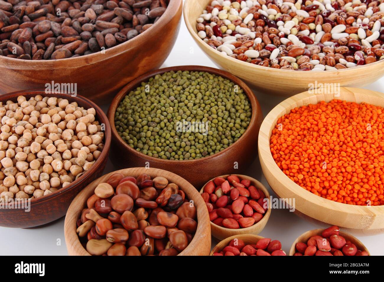 Different kinds of beans in bowls close-up Stock Photo - Alamy