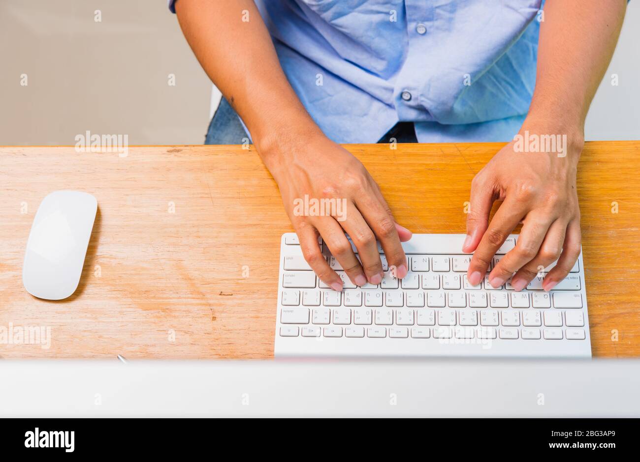 Top view overhead flat lay of Asian businessman working write keyboard ...