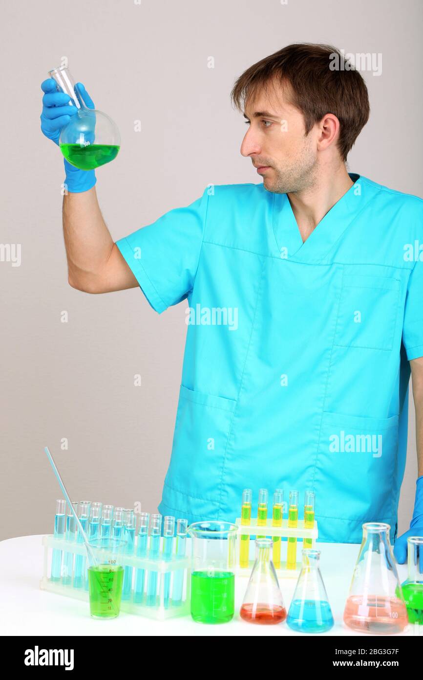 Assayer during research on room background Stock Photo - Alamy