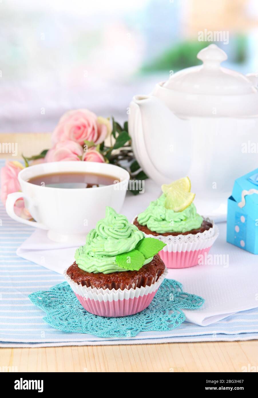 Beautiful cupcakes on dining table on room background Stock Photo - Alamy
