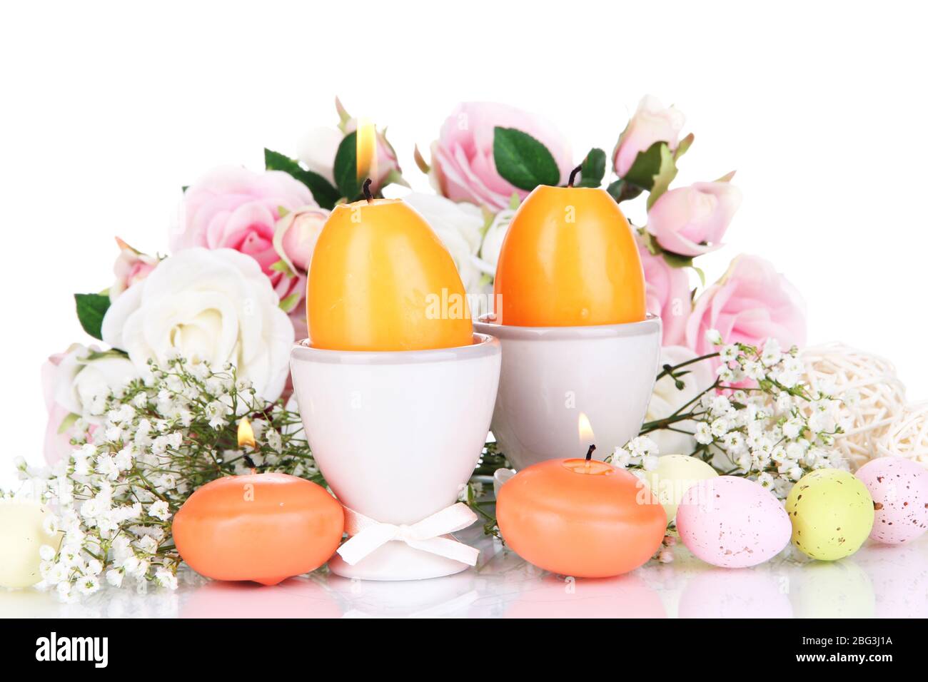 Easter candles with flowers isolated on white Stock Photo - Alamy