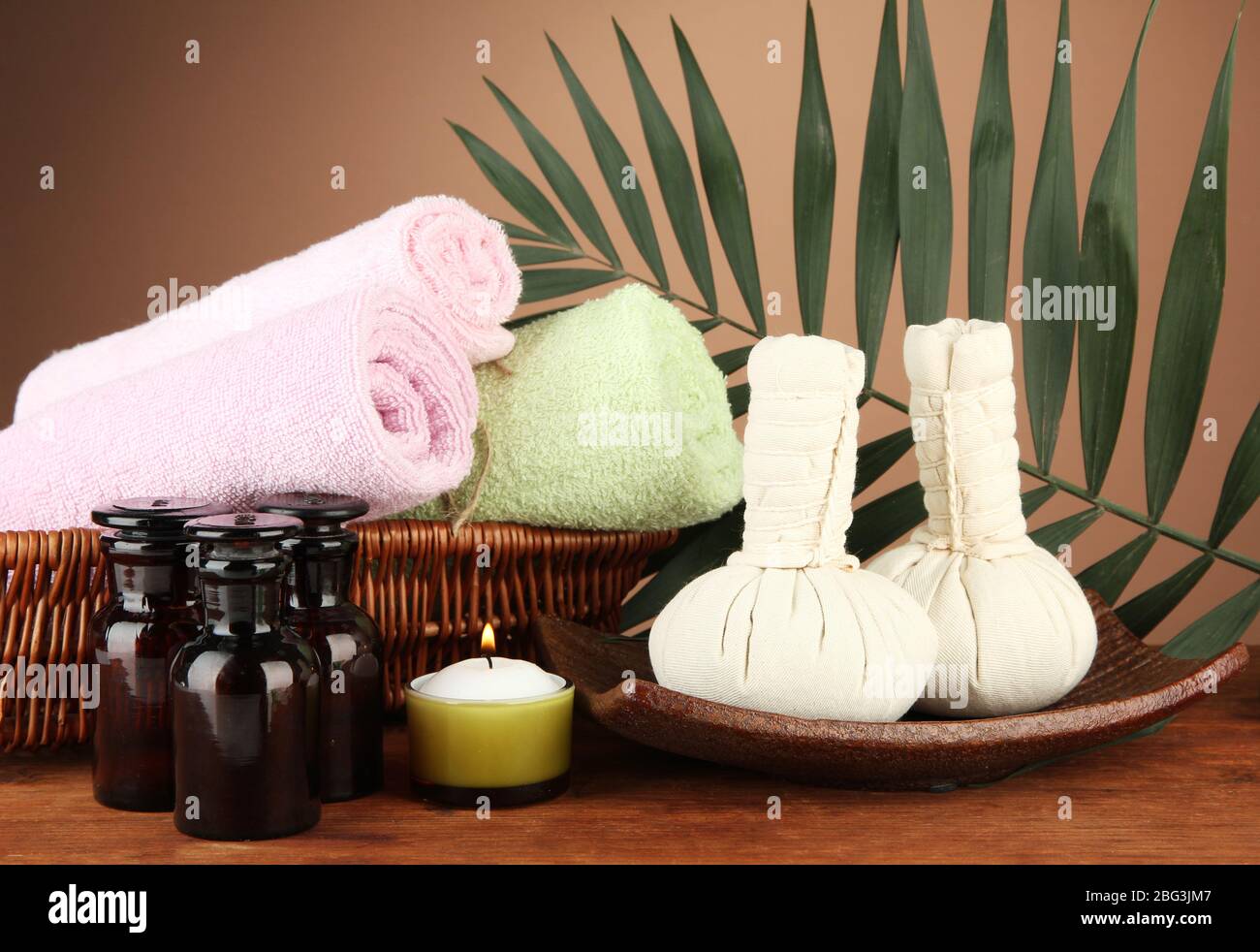 Textile massage spa equipment on a brown background Stock Photo - Alamy