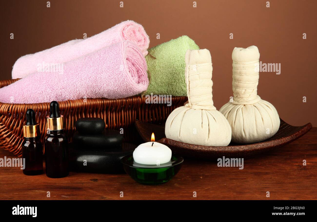 Textile massage spa equipment on a brown background Stock Photo - Alamy