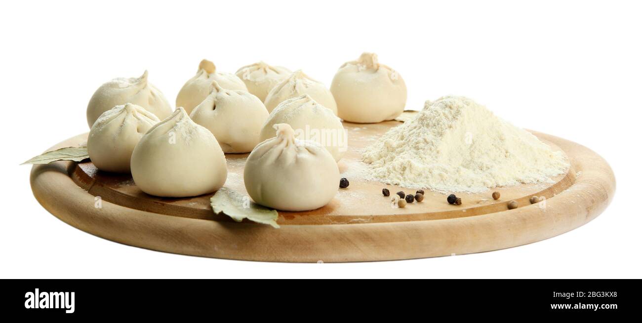 Raw khinkali on wooden desk, isolated on white Stock Photo - Alamy