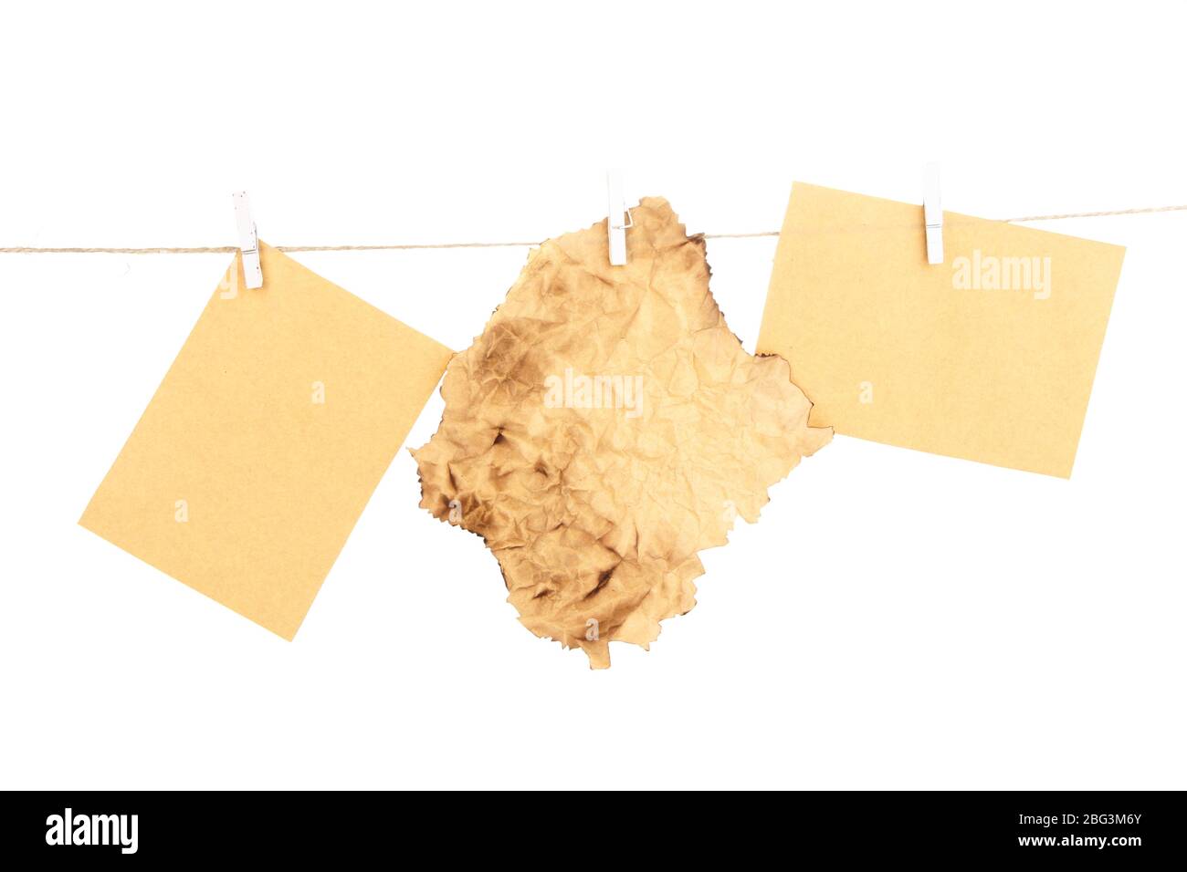 Old sheets of paper hanging on rope isolated on white Stock Photo - Alamy