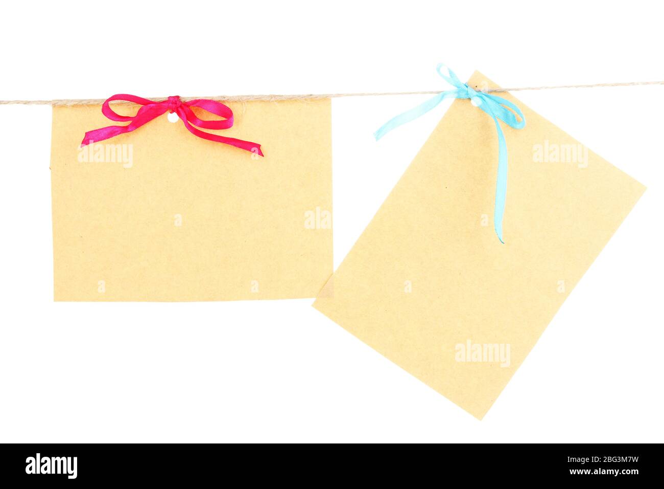 Old sheets of paper hanging on rope isolated on white Stock Photo - Alamy