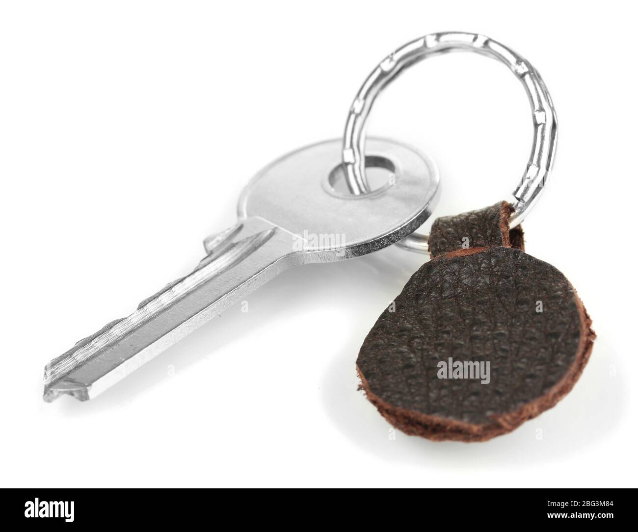 Key with leather trinket isolated on white Stock Photo - Alamy