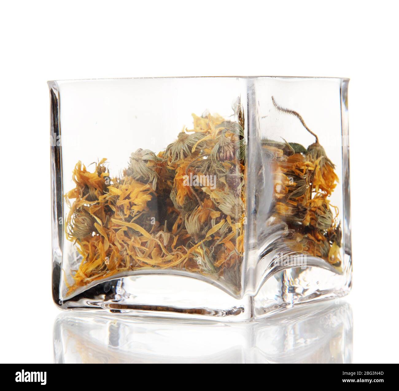 Dried herb in glass container isolated on white Stock Photo - Alamy