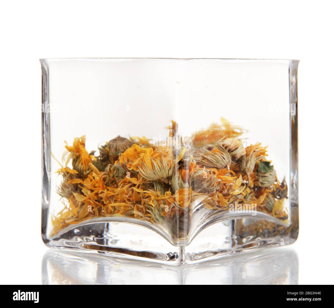 Dried herb in glass container isolated on white Stock Photo - Alamy