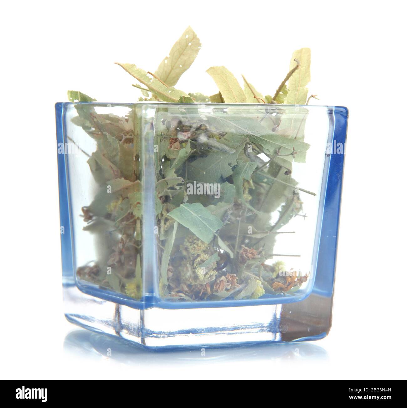Dried herb in glass container isolated on white Stock Photo - Alamy