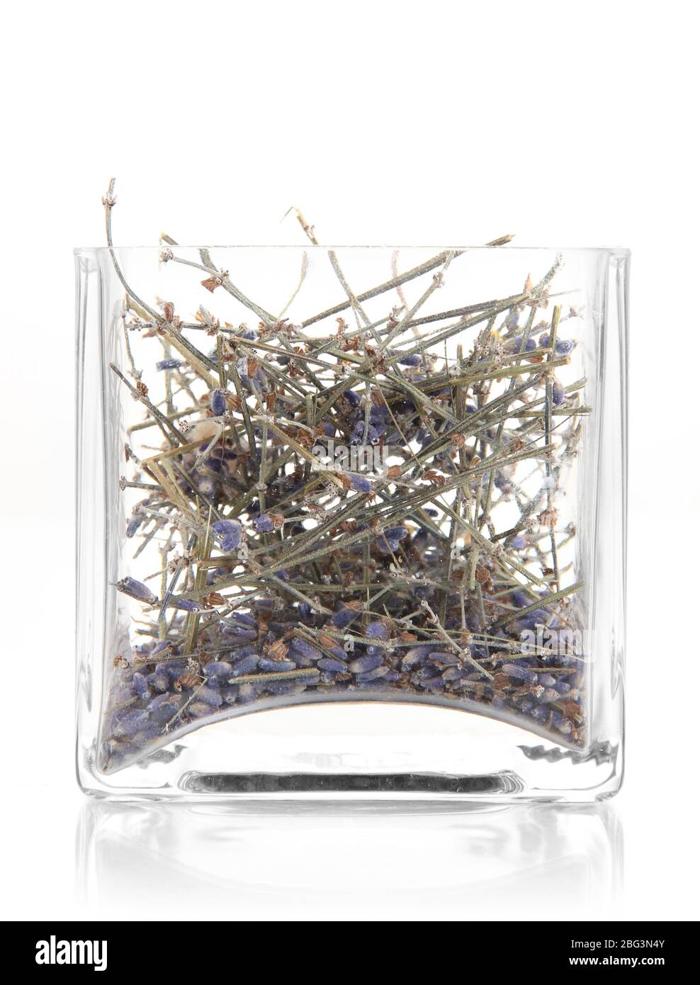 Dried herb in glass container isolated on white Stock Photo - Alamy