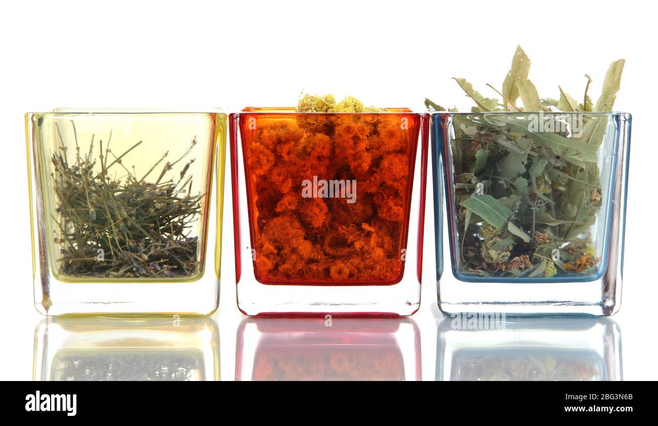 Dried herbs in glass containers isolated on white Stock Photo - Alamy