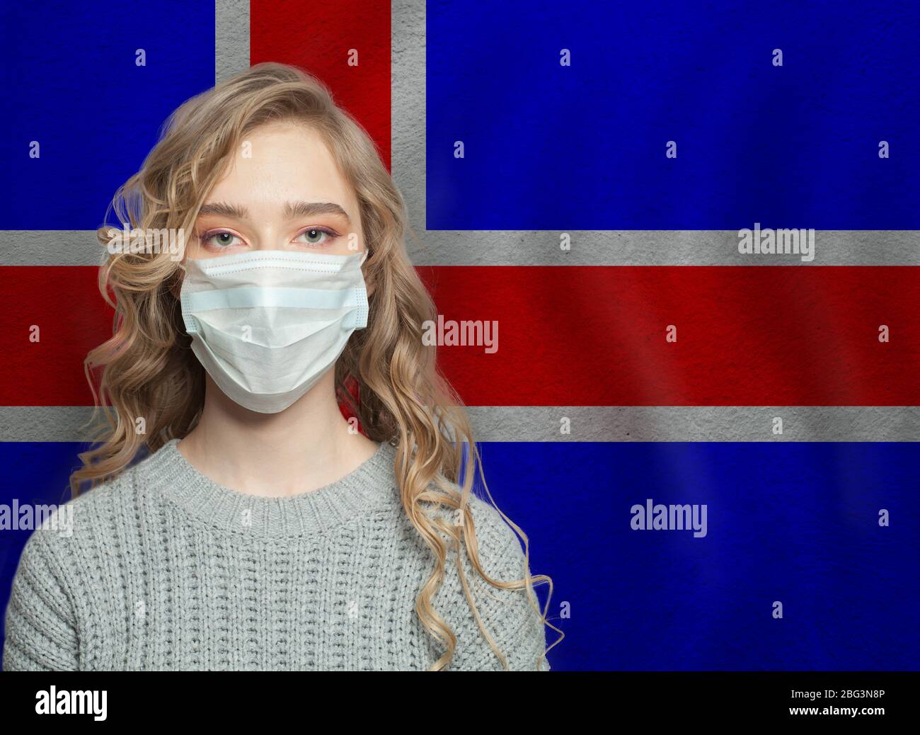 Young woman wearing a face mask with national flag Iceland. Flu ...