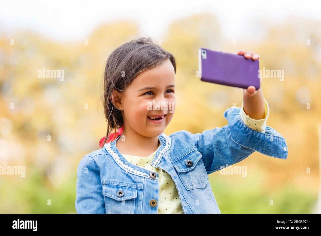Video streaming. Adorable child learning new technology. Little girl ...
