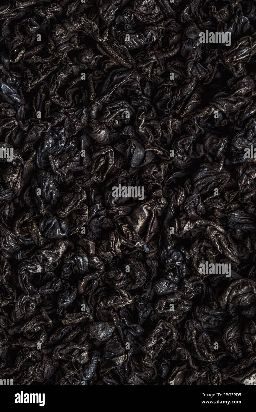Texture of tea. Dry black tea leaves Stock Photo - Alamy