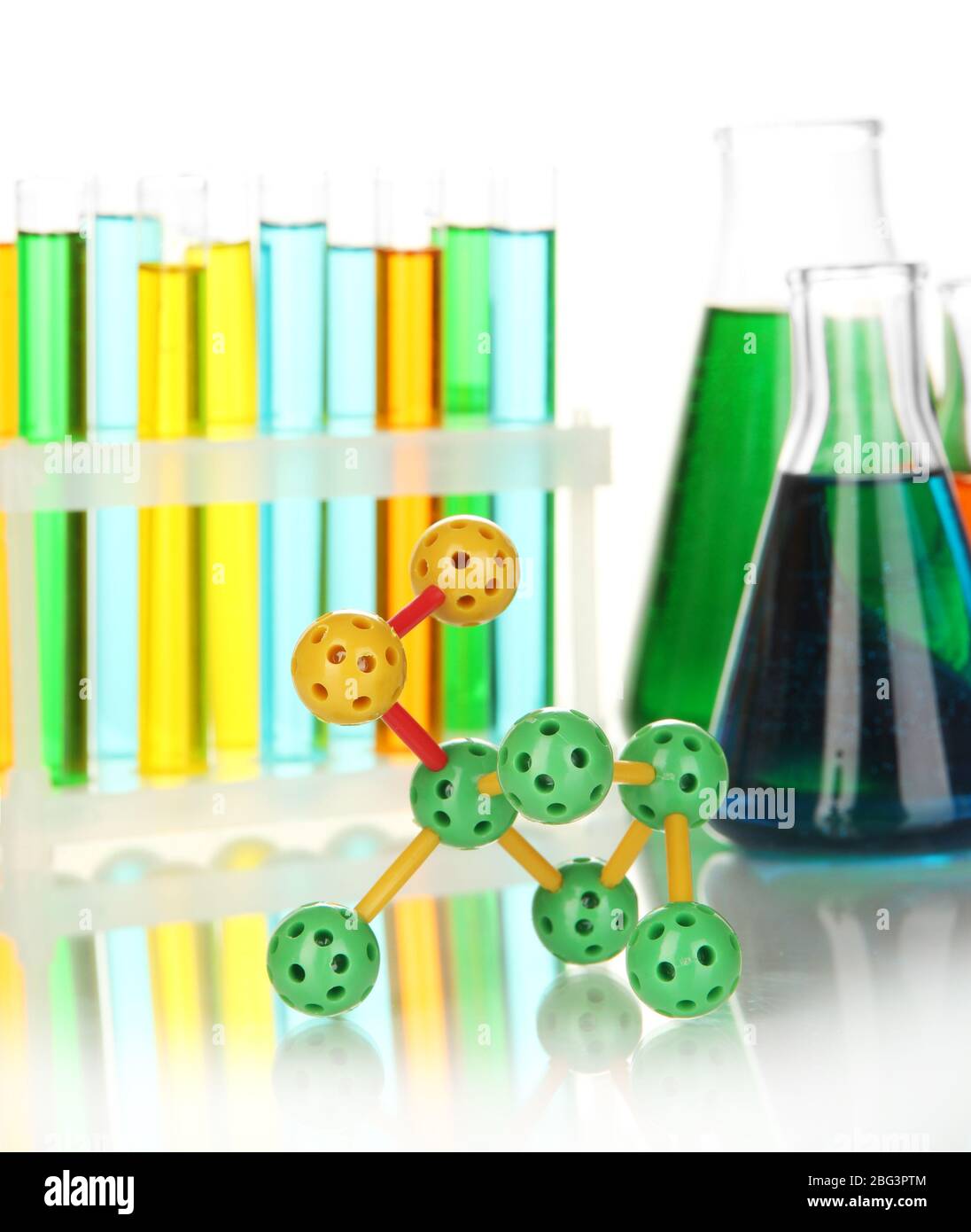 Molecule model and test tubes with colorful liquids isolated on white ...