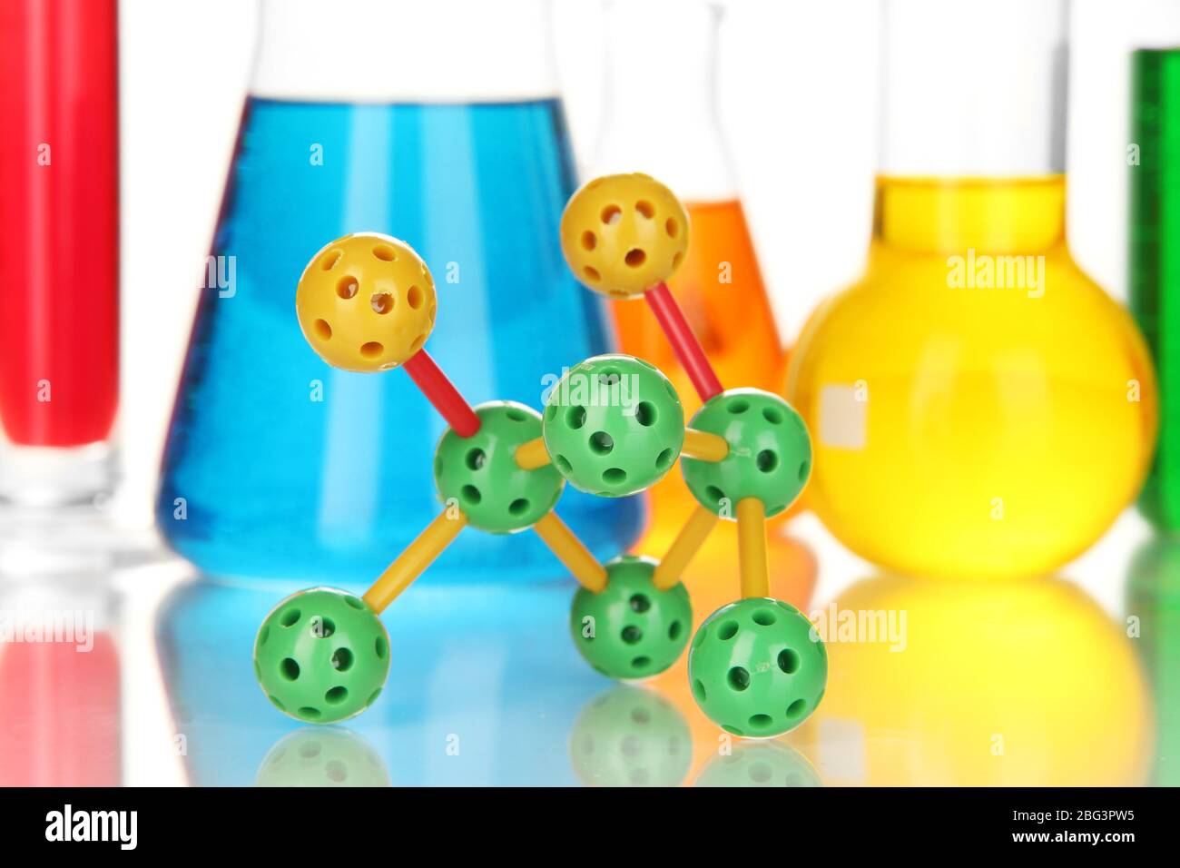 Molecule model and test tubes with colorful liquids close up Stock ...