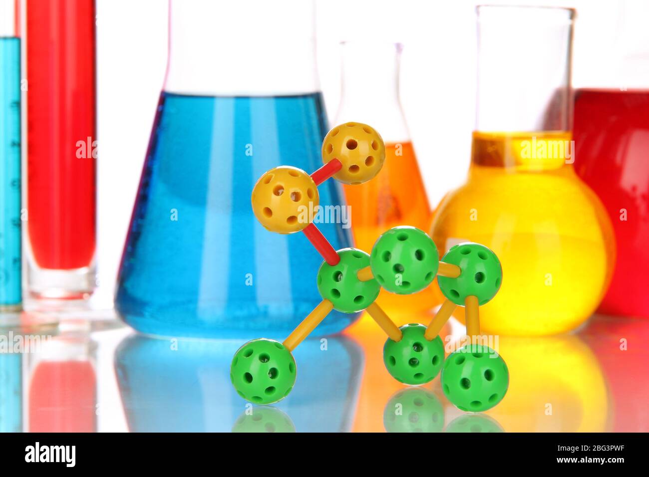 Molecule model and test tubes with colorful liquids close up Stock ...
