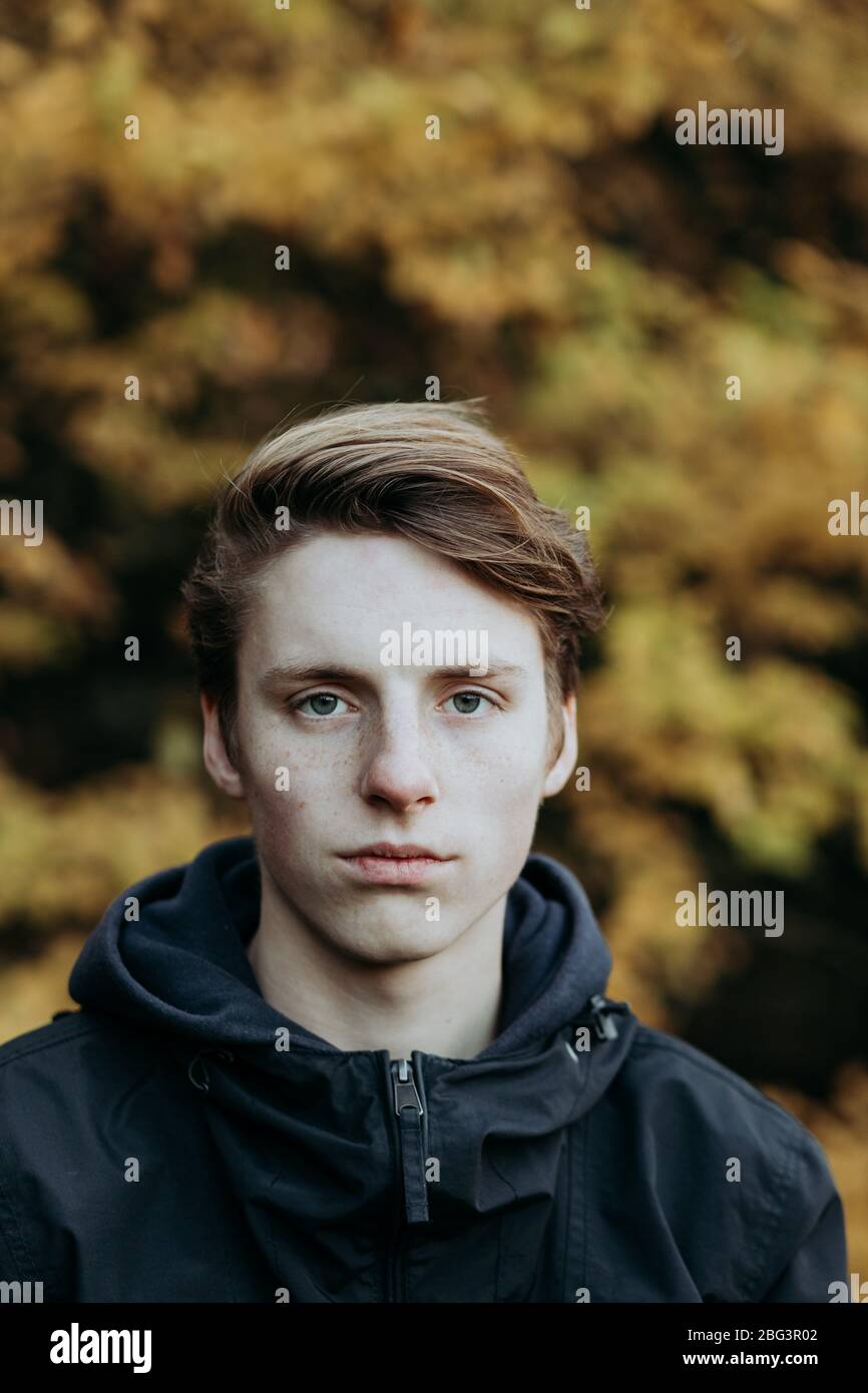 Portrait of a young man standing outdoors in autumn, Netherlands Stock ...