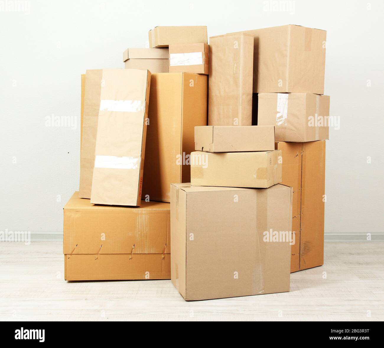 Different cardboard boxes in room Stock Photo - Alamy