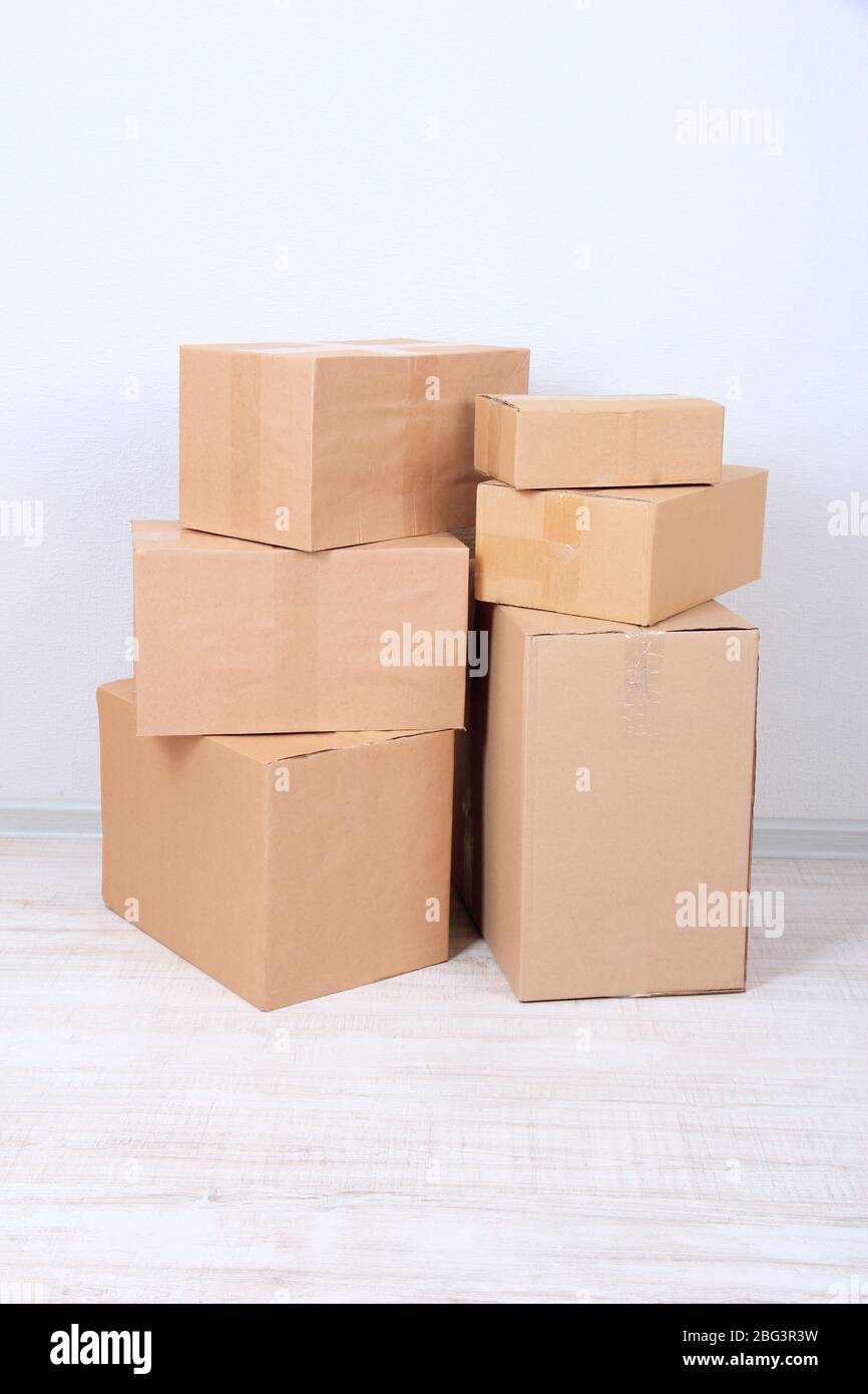 Different cardboard boxes in room Stock Photo - Alamy