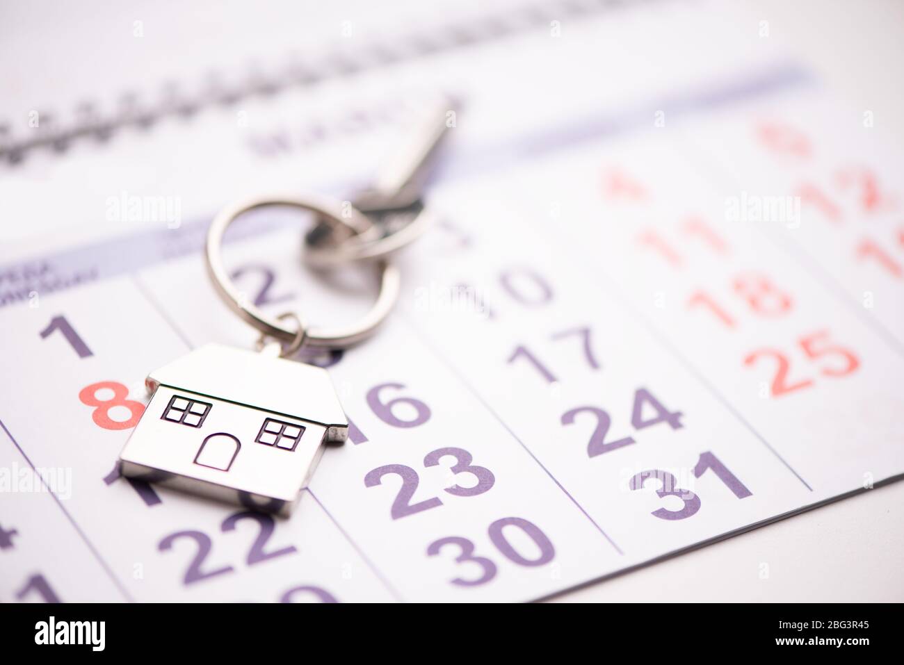 A house key on a calendar background close up Stock Photo - Alamy