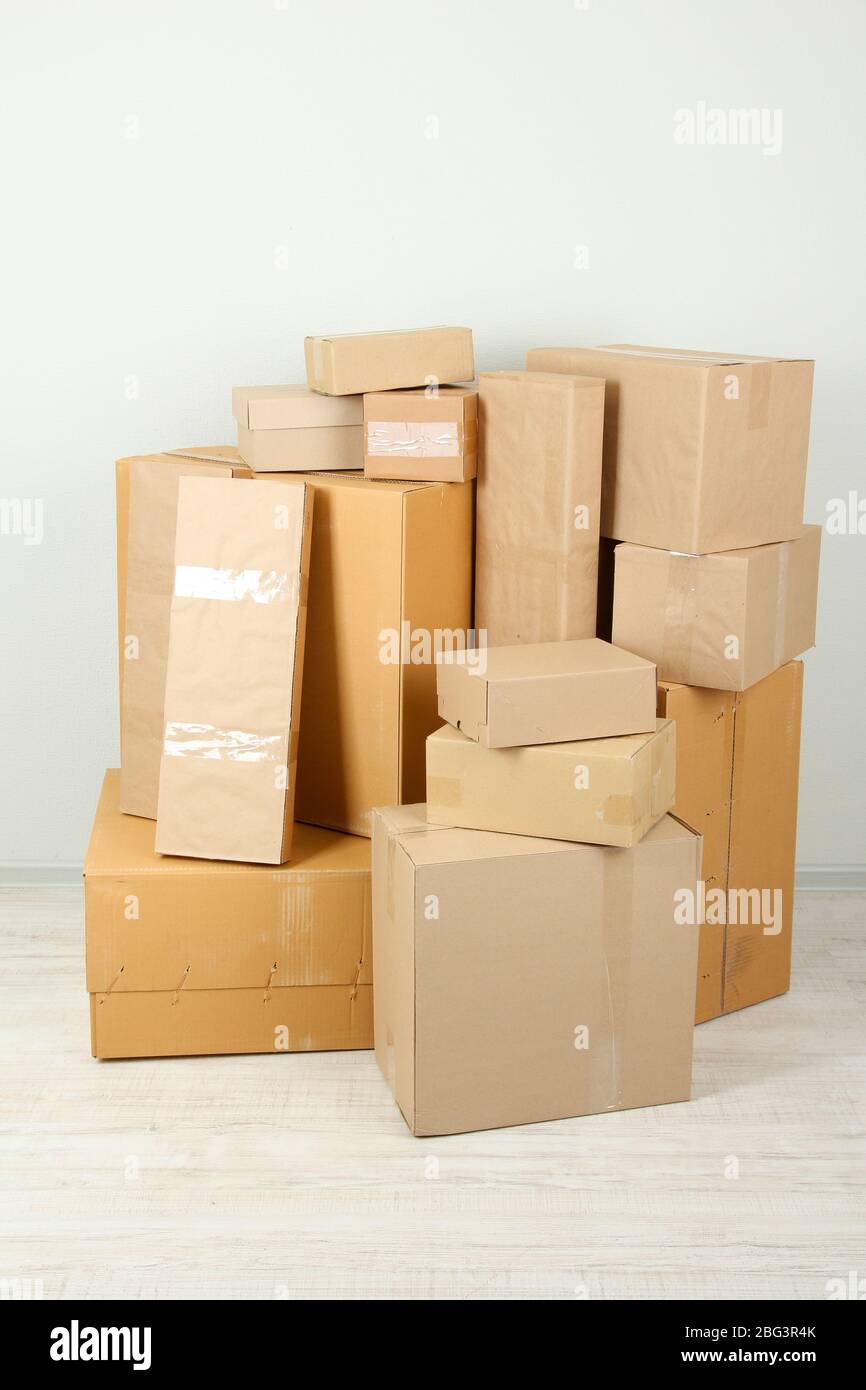 Different cardboard boxes in room Stock Photo - Alamy