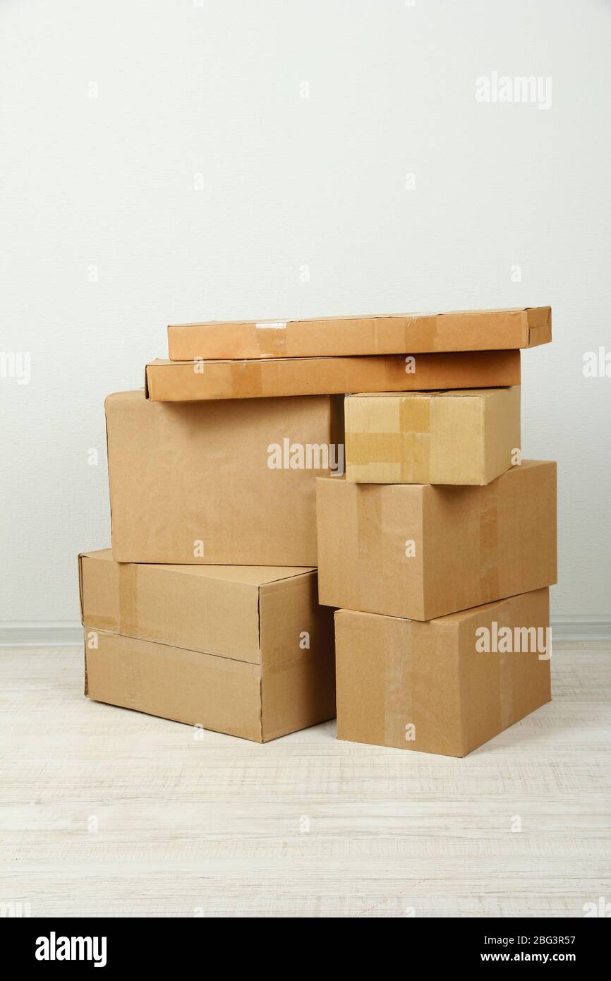 Different cardboard boxes in room Stock Photo - Alamy