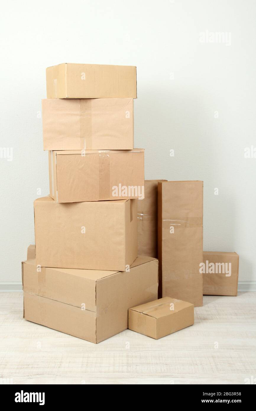 Different cardboard boxes in room Stock Photo - Alamy