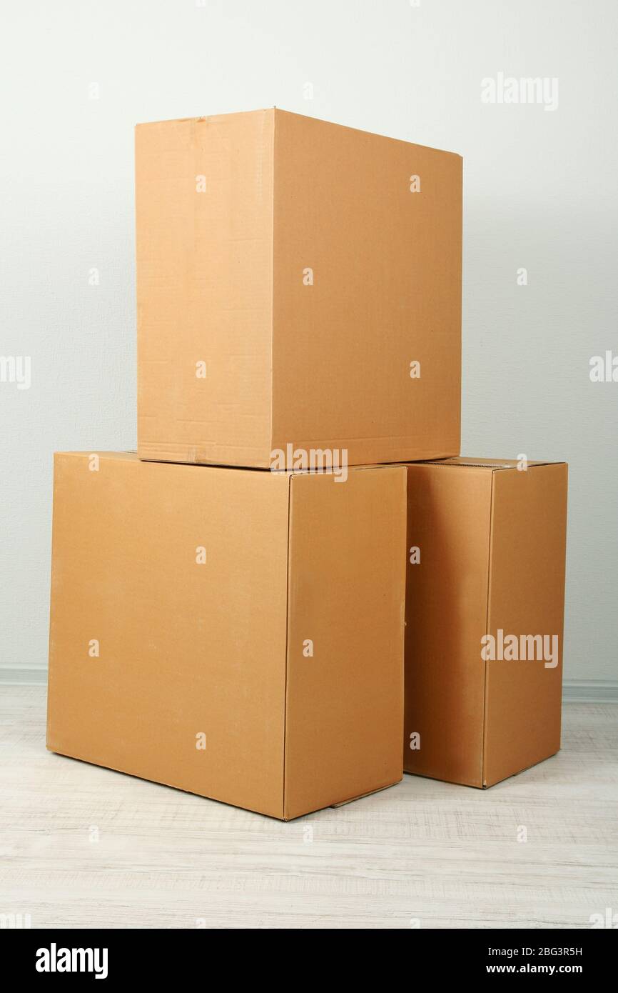 Different cardboard boxes in room Stock Photo - Alamy