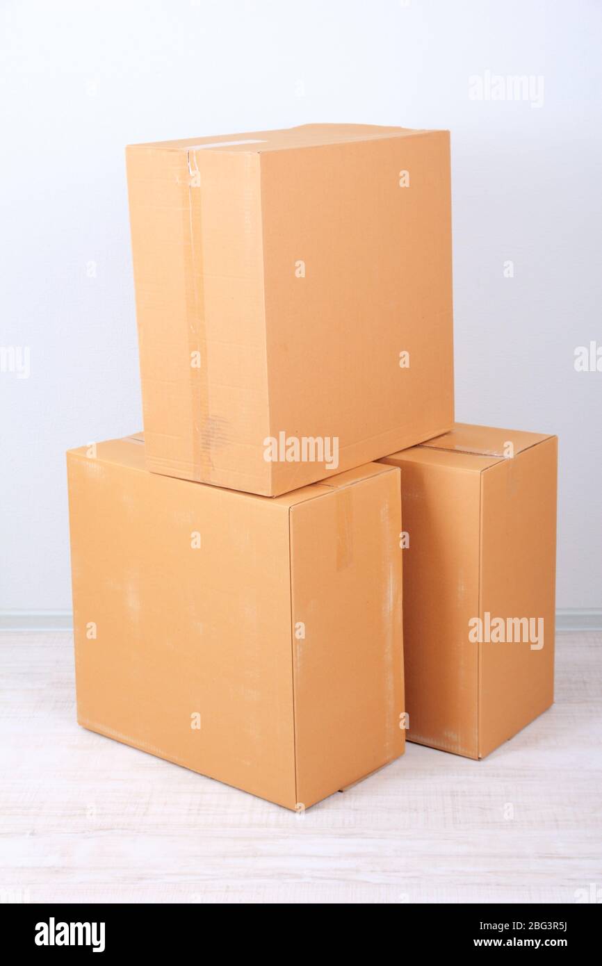 Different cardboard boxes in room Stock Photo - Alamy
