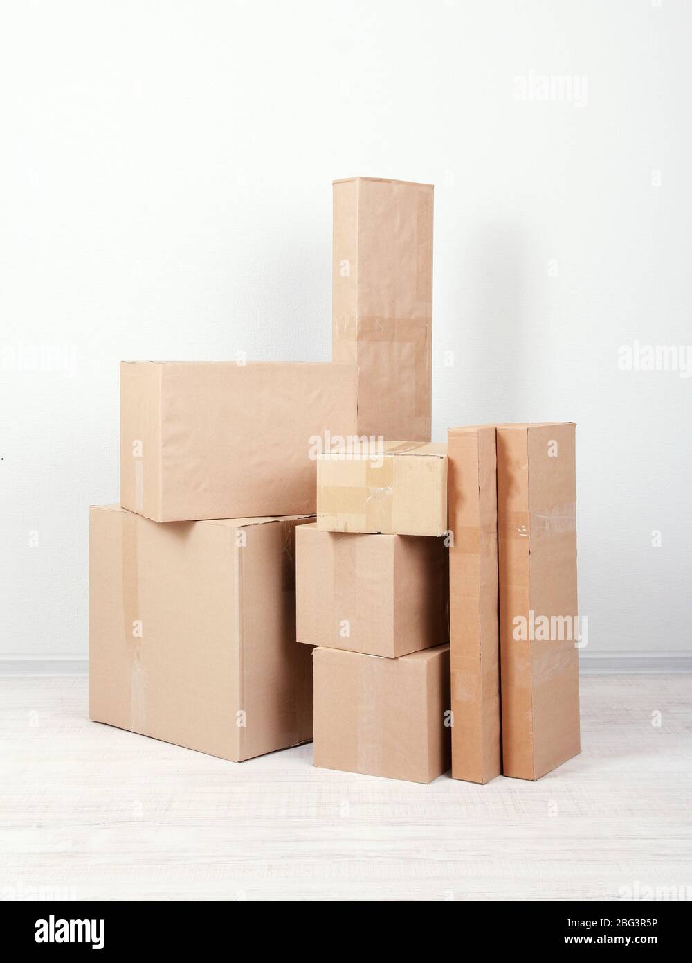 Different cardboard boxes in room Stock Photo - Alamy